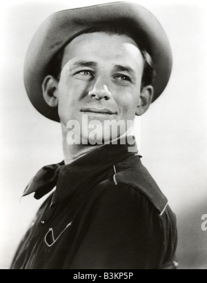 Will Rogers (1879-1935), American cowboy humorist, film star, entertainer, and writer, holding ...
