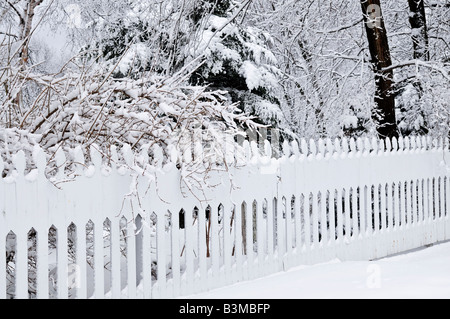 Wooden fence covered with fresh snow in winter Stock Photo - Alamy