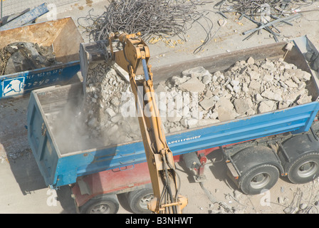 crawler bucket excavator loading semi-trailer truck Stock Photo - Alamy