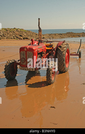 Beach tractor in Jersey Stock Photo - Alamy