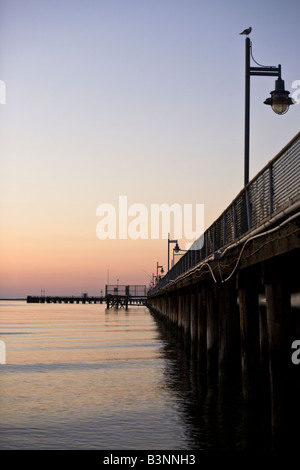 Delaware Bay fishing pier at dusk in Cape Henlopen State Park, Delaware ...