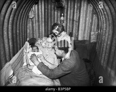 A family inside their air raid shelter during WW2 with the mother ...