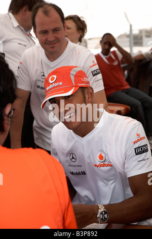 Lewis Hamilton signs autographs for Formula 1 fans at Shoe Palace at ...
