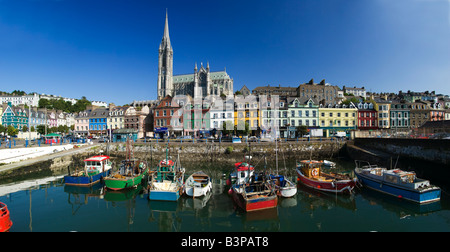 Popular as a tourist destination Cobh harbour with brightly coloured ...