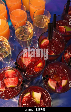 Still life aperitif with drinks and various appetizers, on white ...