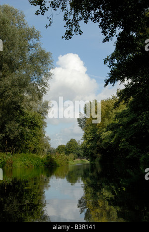The River Wey navigation canal on a sunny autumnal and calm day at ...