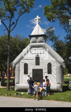 inflatable church bounce house at event Stock Photo - Alamy