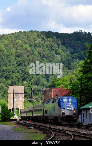 Amtrak passenger train passing through downtown Seattle waterfront ...