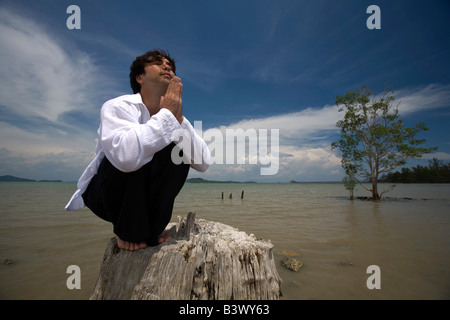 Man praying by the beach, Koh Lanta, Thailand, Asia Stock Photo - Alamy