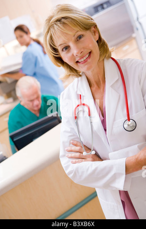 Doctor woman or nurse in a hospital office with her colleague and ...