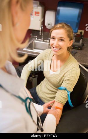 Young blonde woman doctor having telemedicine at clinic Stock Photo - Alamy