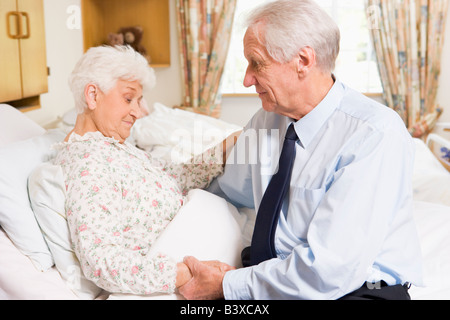 Senior man visiting wife in hospital Stock Photo - Alamy