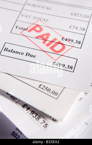 Invoice with Paid Stamp - close-up of invoice with Paid stamp, figures ...