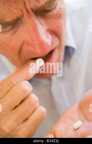 Man Taking Tablets Stock Photo - Alamy