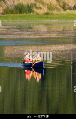 Mother and son canoeing on Upper Stillwater Lake in Montana model ...