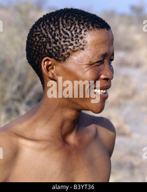 Portrait of a bushmen from the Kalahari desert with traditional weapons ...