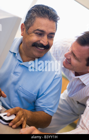 Smiling men looking at each other Stock Photo - Alamy