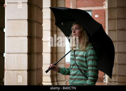 People in Exeter in the rain Stock Photo - Alamy