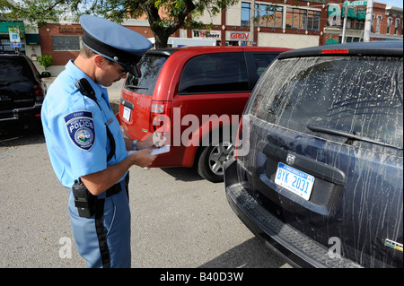 A parking enforcement officer writing a ticket - Washington, DC USA ...