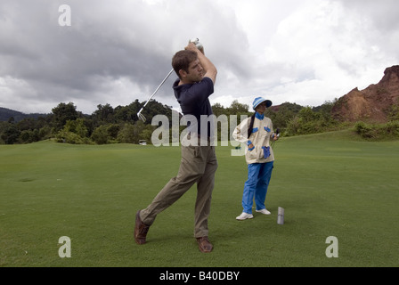 Golf caddies. Phuket Thailand Stock Photo - Alamy