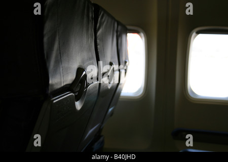 Airplane / plane seat tray table in the full down position and ready ...
