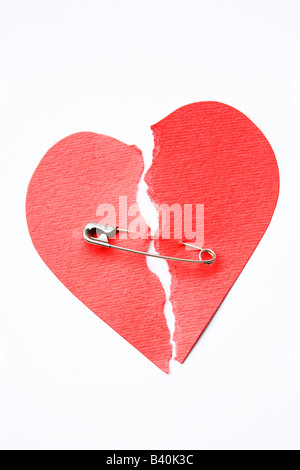 Broken heart joined with safety pin Stock Photo - Alamy