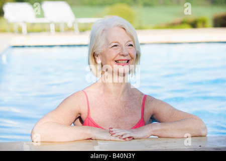 Woman in outdoor pool smiling Stock Photo - Alamy