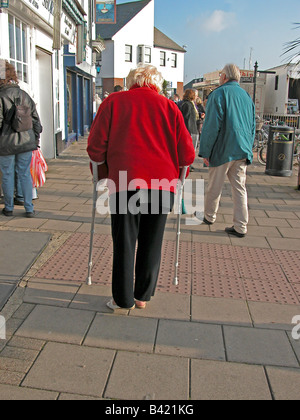 elderly woman walking with calipers Stock Photo - Alamy