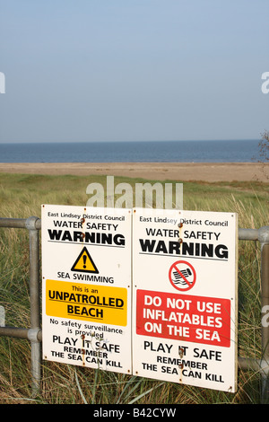 Beach safety warning sign Stock Photo - Alamy
