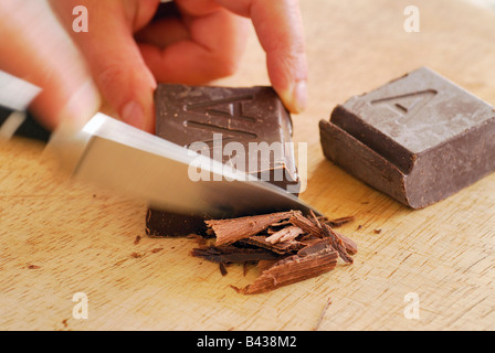 Making dark chocolate flakes Stock Photo - Alamy