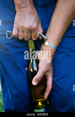 man uncorking a bottle Stock Photo - Alamy