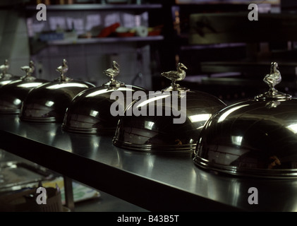 Silver covers for plates Stock Photo - Alamy