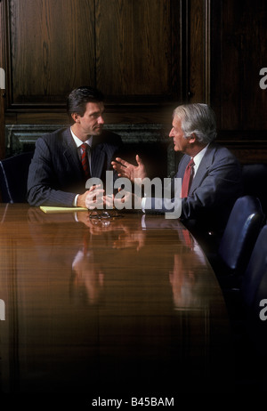 Two executives in a boardroom meeting Stock Photo - Alamy