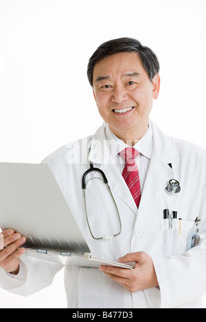 portrait old asian man doctor in gown with digital tablet Stock Photo ...