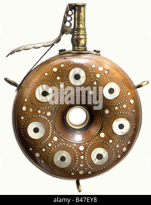 A German priming flask, circa 1600. Ring shaped fruitwood body richly ...
