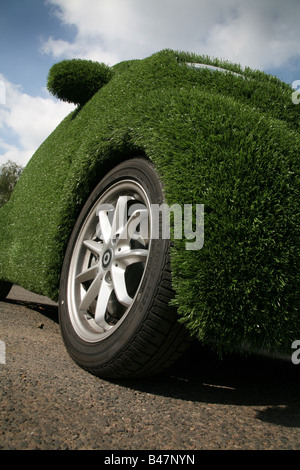 Smart car covered in artificial grass in street London UK Stock Photo ...