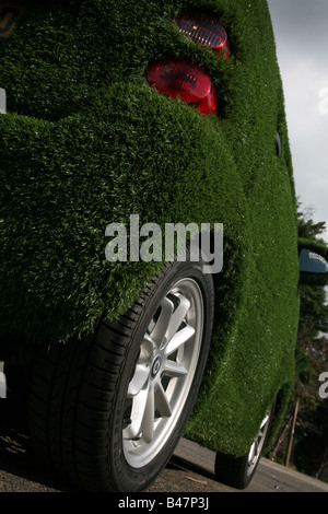 Smart car covered in artificial grass in street London UK Stock Photo ...