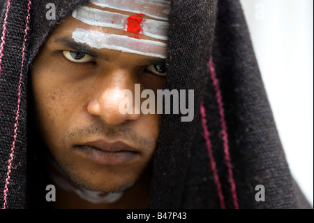Portrait of an Indian man with a religious symbol painted in red on his ...