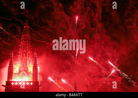 intense red fireworks on a Christian church with dense smoke, patrick ...