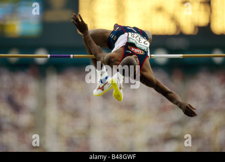 American high jump athlete Charles Dumas setting a new record at 7 feet ...