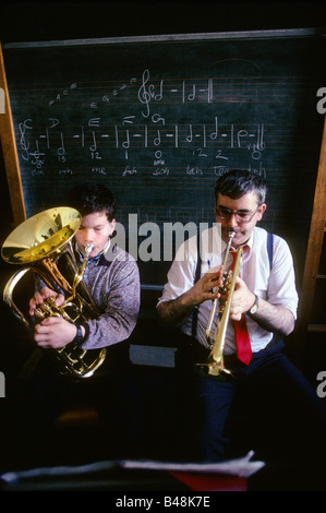 TEACHER & STUDENT PLAYING BRASS INSTRUMENTS IN MUSIC CLASS, HOLYROOD ...