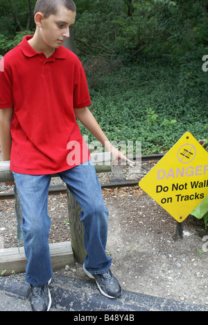 Danger sign posted on the railing in Niagara Falls, Ontario, Canada ...