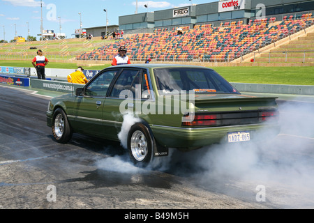 Australian Holden Commodore drag race racing car performing a burnout ...