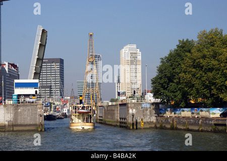 Boat entering Wijnhaven port harbour in Rotterdam sailing under open ...