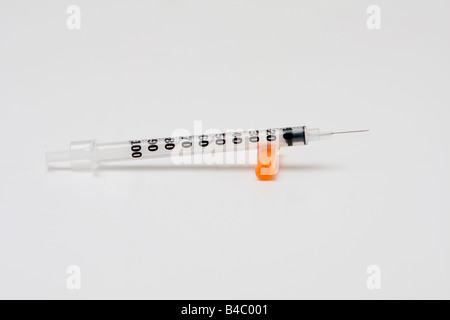 Insulin syringe with orange cap and needle, isolated Stock Photo - Alamy