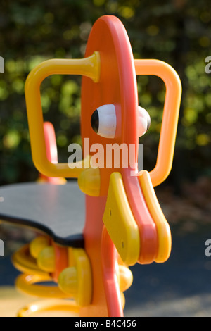 Duck spring rider in a childrens playground Stock Photo - Alamy