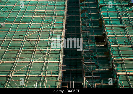 A tower block clad in scaffolding Stock Photo - Alamy