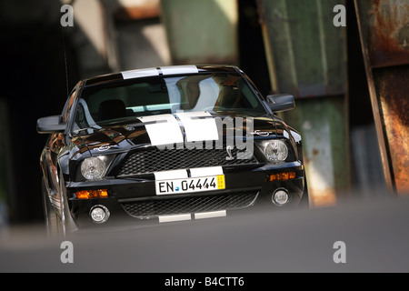 The front of a 2006 Ford Mustang GT on display at a car show Stock ...