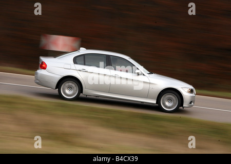 BMW 325d, model year 2006-, silver, driving, diagonal from the back ...