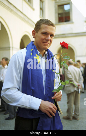 Happy young man with flag of Poland on green background Stock Photo - Alamy